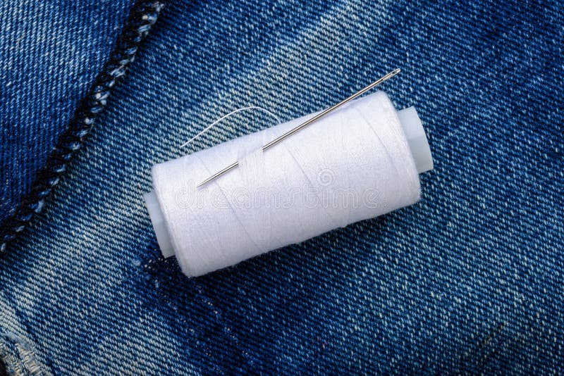 Roll of White Thread and Jeans Stock Photo - Image of clothing, texture ...