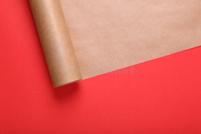 Roll of Wrapping Paper on Red Background, Top View. Space for Text ...
