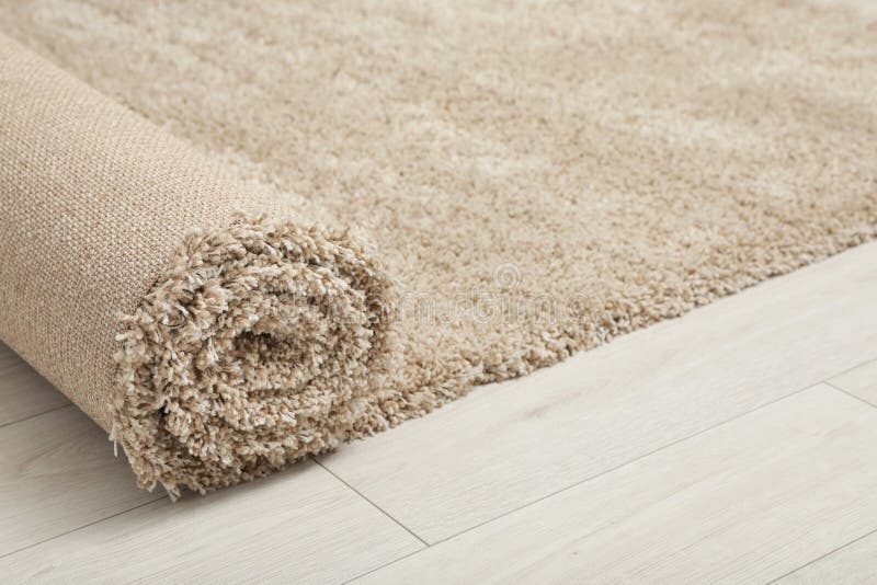Rolled Beige Carpet on Floor, Closeup. Space for Text Stock Image ...