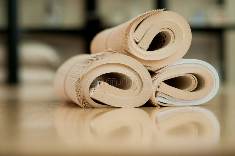 Rolled book on the table stock photo. Image of interior - 11271956