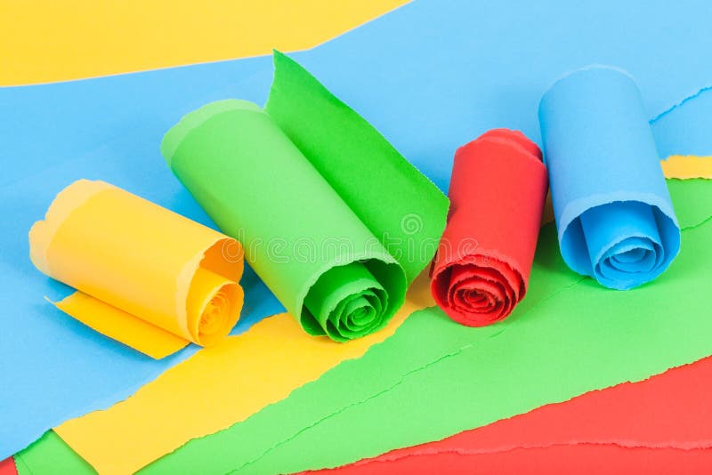 Rolled Colour Paper on Sheets of Torn Paper Stock Photo - Image of ...