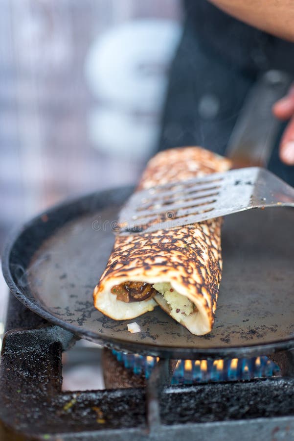 Rolled Dosa Cooking on a Hot Skillet Stock Photo - Image of potato ...