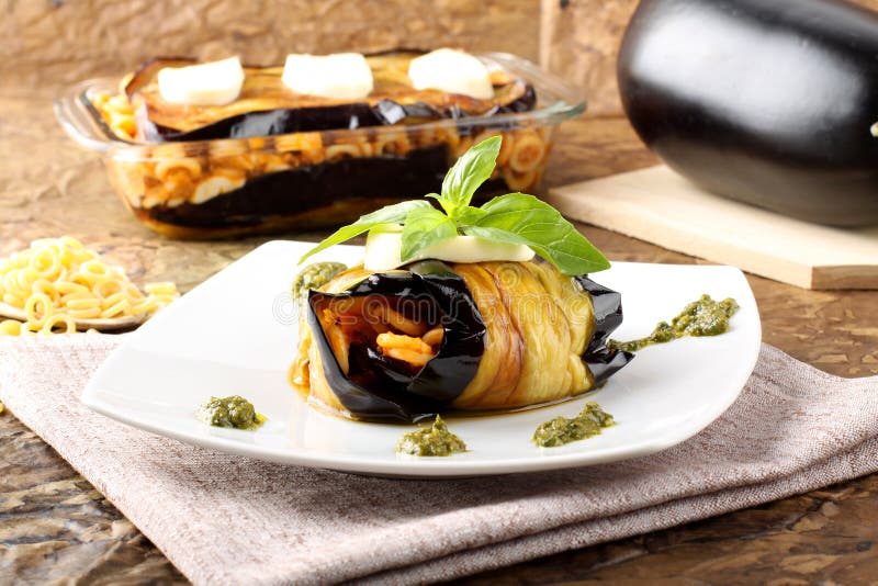 Rolled Eggplant Stuffed with Pasta Stock Photo - Image of glass ...