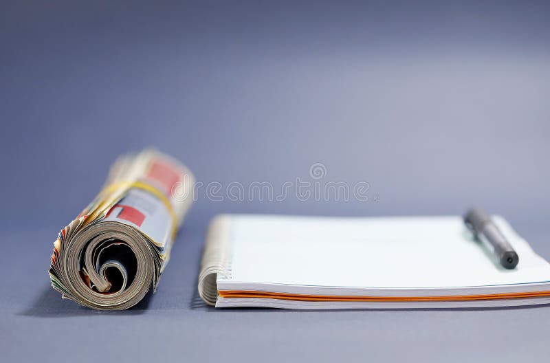 Rolled Magazine and Notebook Stock Image - Image of memo, installation ...