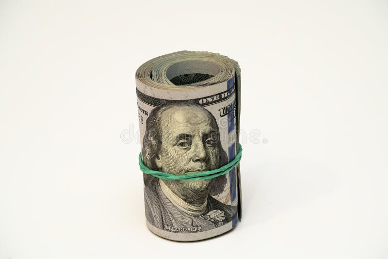 Rolled Money Banknote Secured with a Rubber Band on a White Surface ...