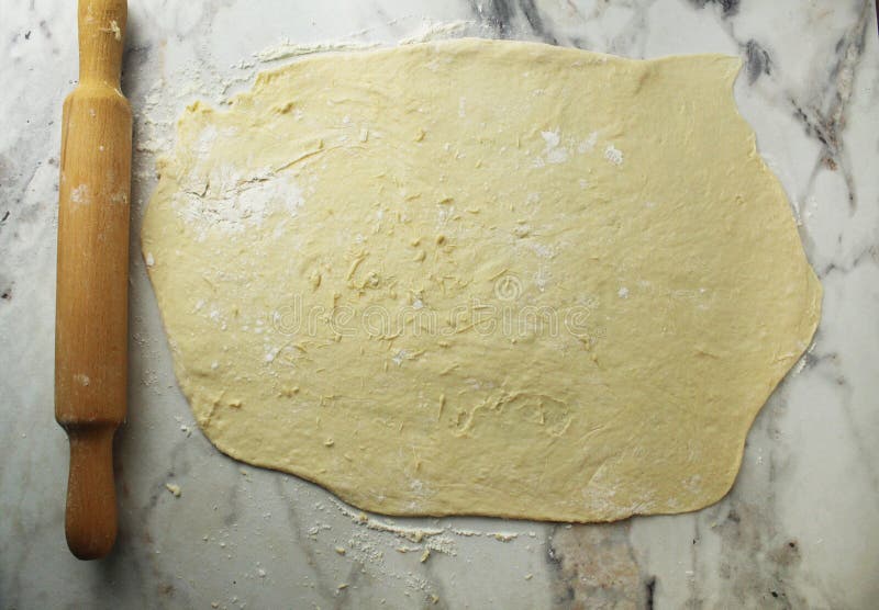 Rolled Out Layer of Yeast Dough on a Table with Flour Stock Photo ...