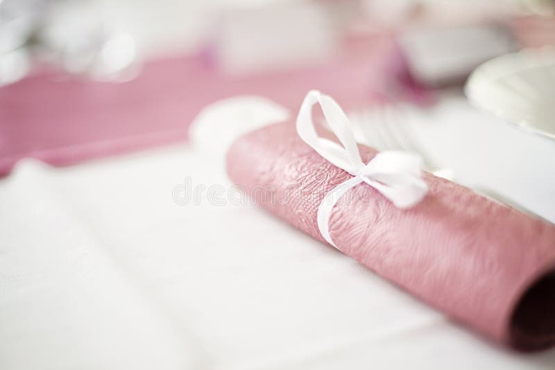Rolled Pink Table Napkin Placed on a Dining Table Stock Image - Image ...