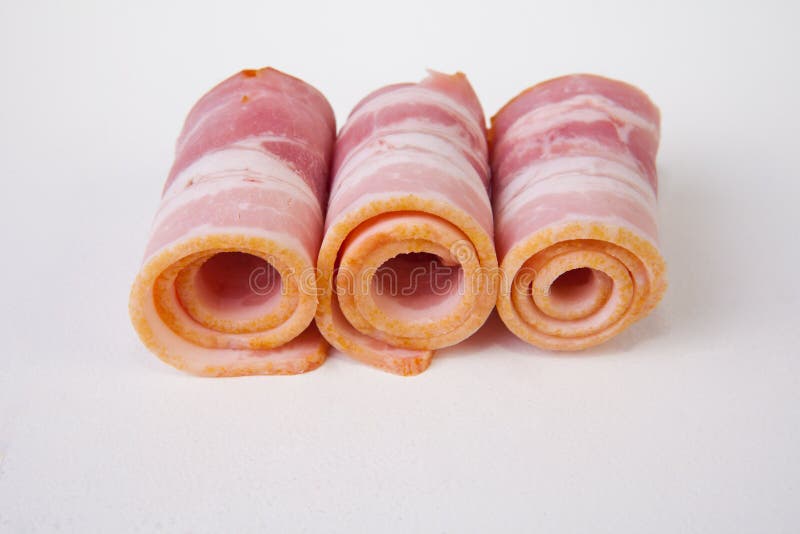 Rolled raw bacon slices stock image. Image of pile, meal - 48867609