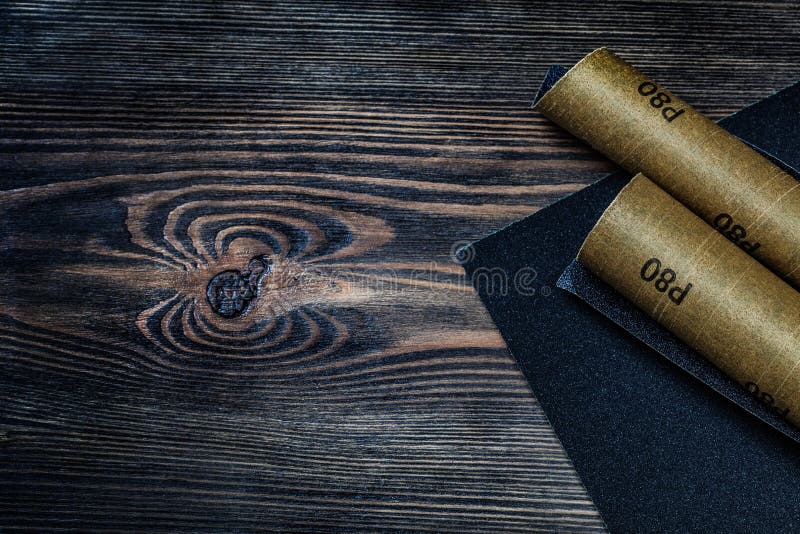 Rolled Sand Paper on Vintage Wood Stock Photo - Image of sanding ...