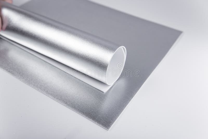 Rolled Silver Sheet of Cardboard. Sheets of Shiny Isolon. Metallic ...
