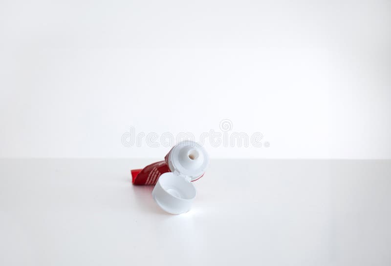 Rolled and Squeezed Out Empty Plastic Toothpaste Tube, Isolated on ...
