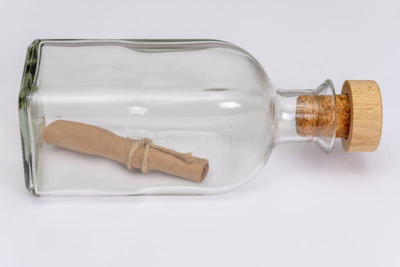 A Rolled-up Old Paper Note in a Glass Bottle with a Cork on a Light ...