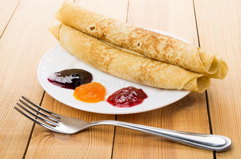 Pancakes in Plate, Spoon with Condensed Milk on Pancake in Saucer ...