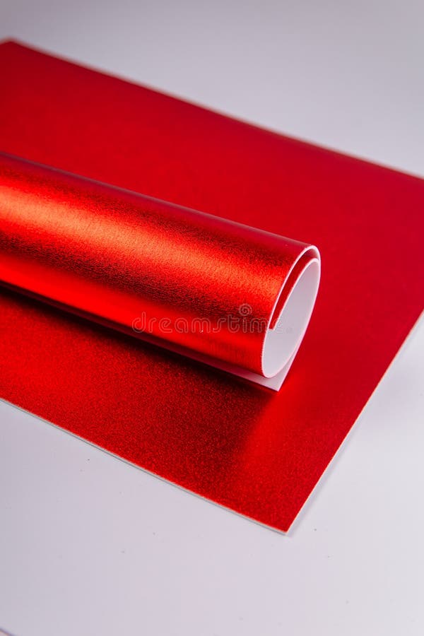 Rolled Up Red Sheet of Cardboard. Sheets of Shiny Isolon. Izolon Stock ...