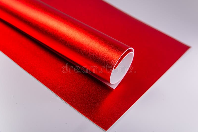 Rolled Up Red Sheet of Cardboard. Sheets of Shiny Isolon. Izolon Stock ...