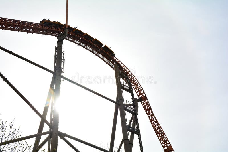 Roller Coaster in the Amusement Park with Sun Stock Photo - Image of ...