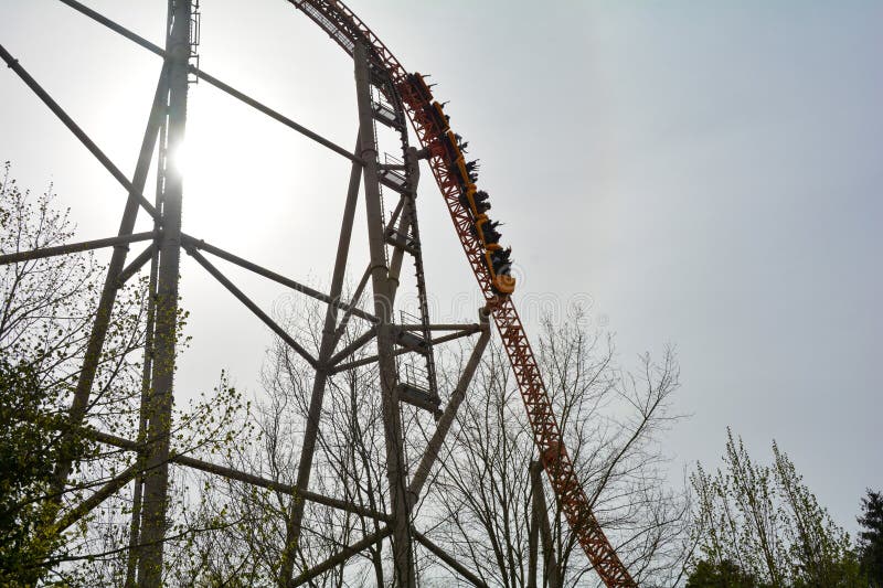 Roller Coaster in the Amusement Park with Sun Stock Photo - Image of ...