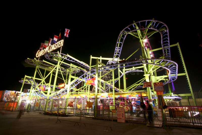 Roller Coaster in the dark stock image. Image of flags - 7954903