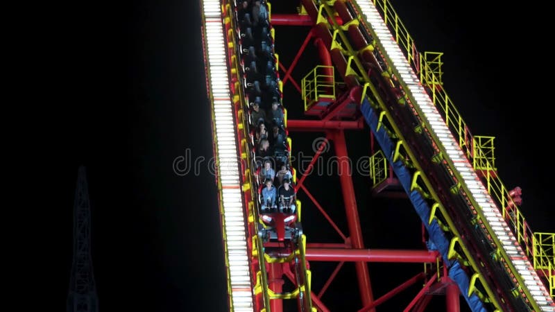 Roller Coaster at Night in a City Amusement Park Stock Video - Video of ...