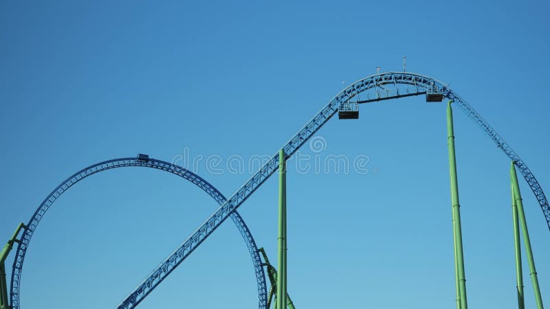 A Roller Coaster Ride Passing through a Dead Loop Turning Passengers ...