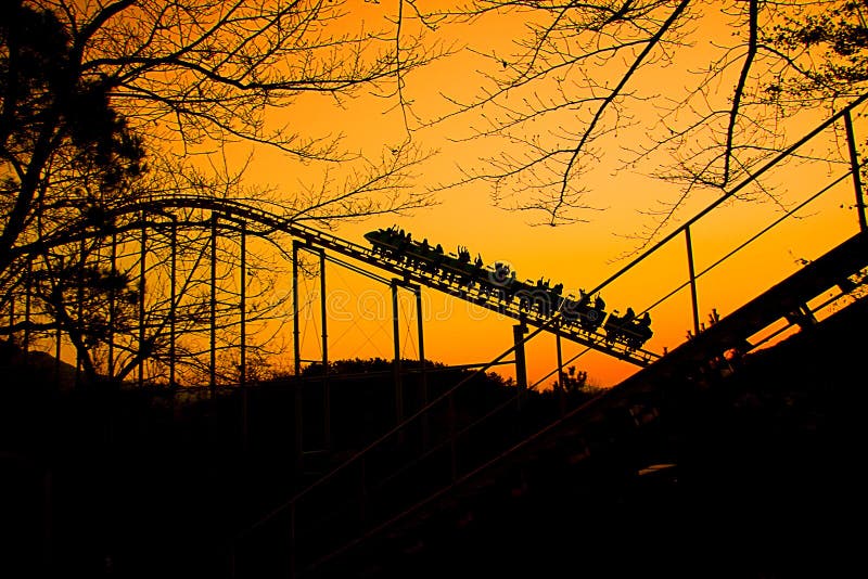 Roller Coaster Train is Going Up at Autumn Sunset Stock Photo - Image ...