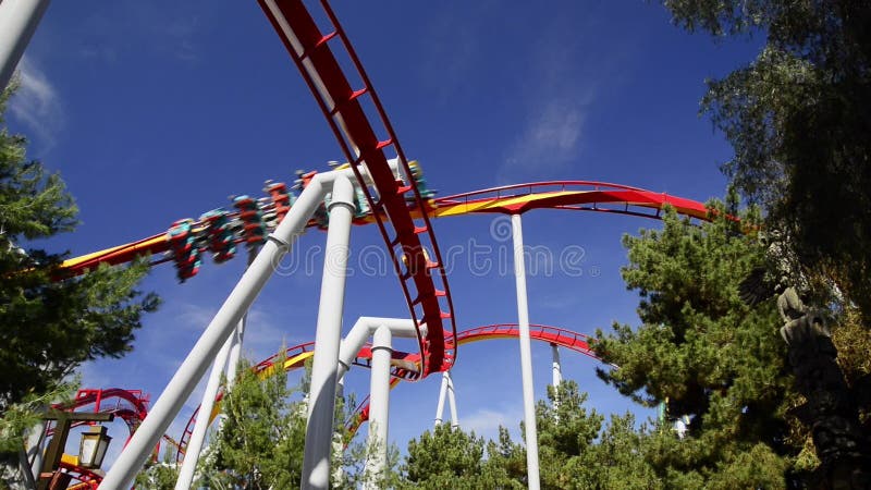 Roller Coaster in the Amusement Park. Cheerful Entertainments in Park ...
