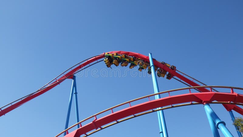 Roller Coaster Twisting Under Clear Blue Sky Stock Image - Image of ...