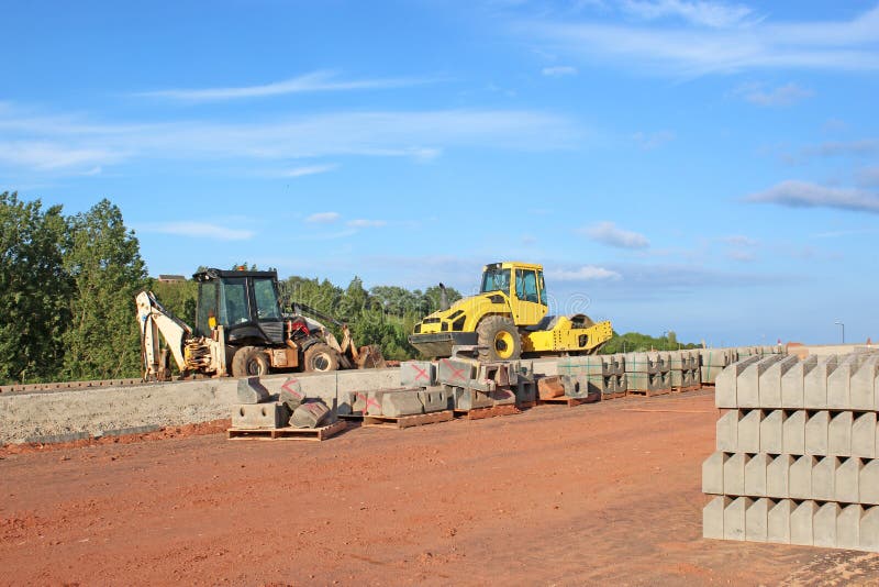 Roller and Digger on a Construction Site Stock Image - Image of road ...