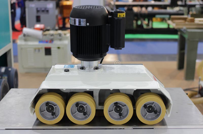 Roller Feeder for Automatic Wood Cutting Industrial Machine. Stock ...