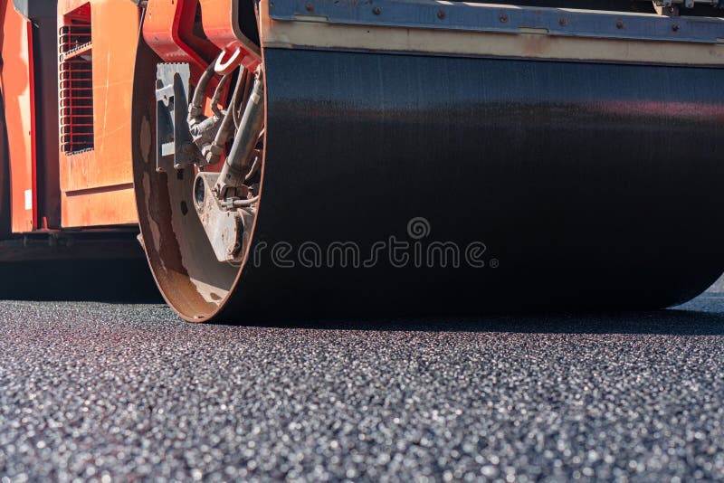The Roller Flattens the Asphalt Tar, Paving the New Asphalt Stock Image ...