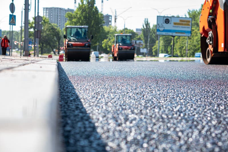 The Roller Flattens the Asphalt Tar, Paving the New Asphalt Stock Image ...