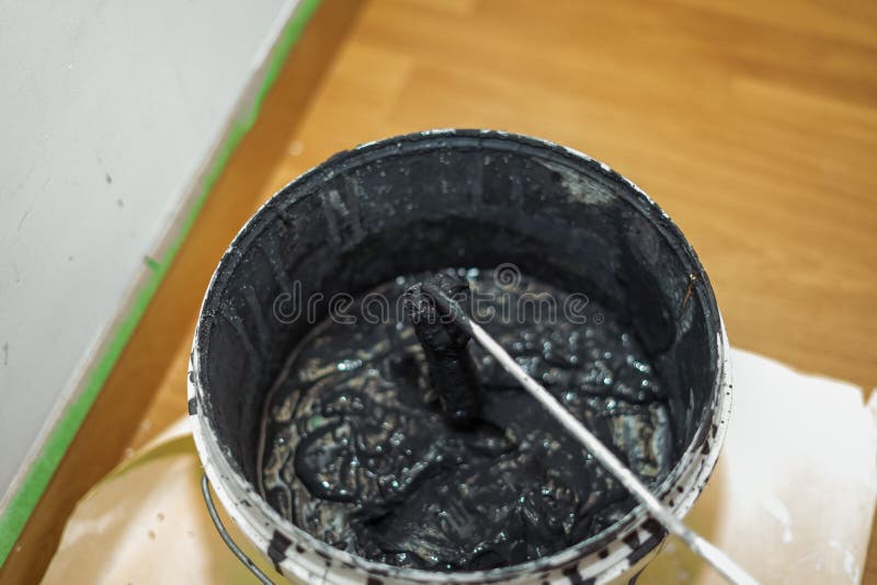 Roller Paint with Black Paints in a Container Stock Photo - Image of ...