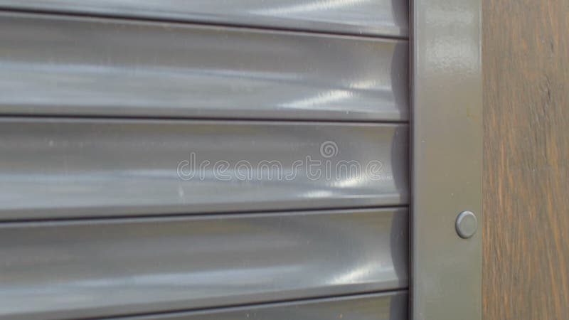 Roller shutter closed stock footage. Video of protection - 163592040