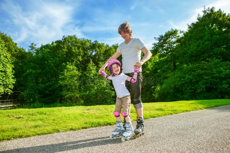 Roller skating stock image. Image of assist, daughter - 31983883