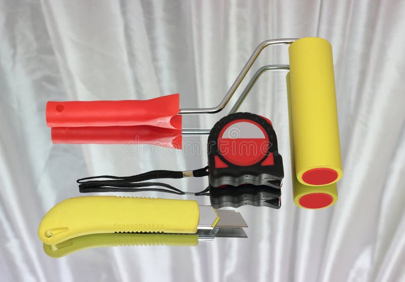 The Roller for Wallpaper, Roulette and Knife with Reflection Stock ...