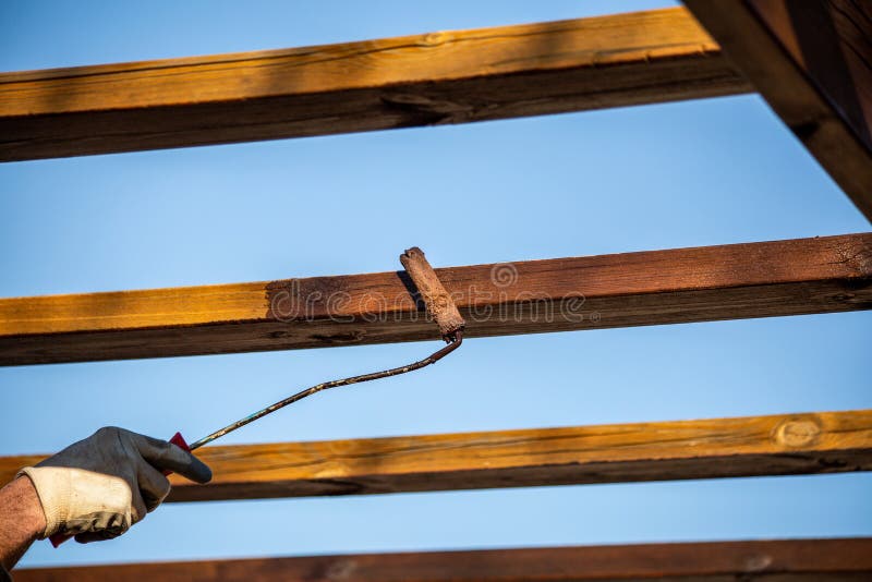 Roller with Wood Painting Work. Dark Walnut Wood Paint Stock Photo ...