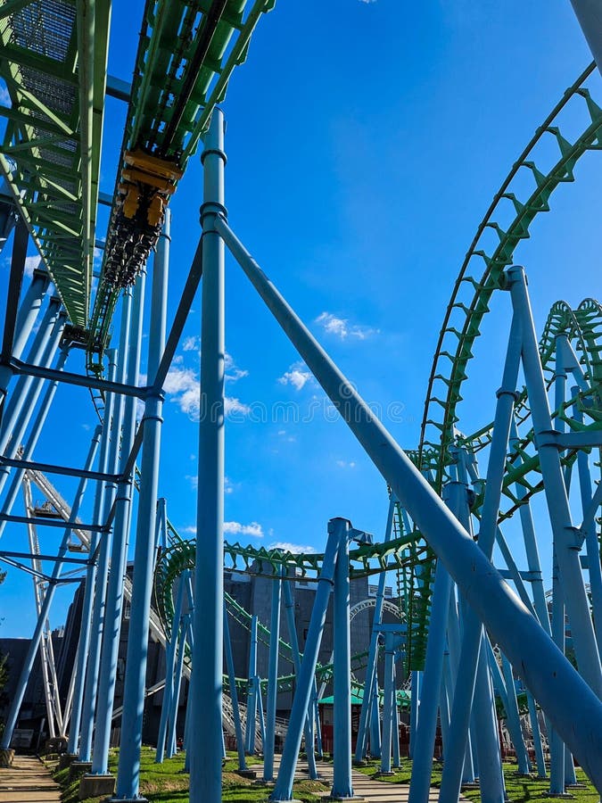 Rollercoaster in Motion stock photo. Image of riders - 373974364