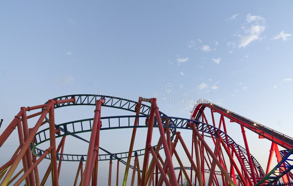 Rollercoaster Ride in an Amusement Park Against a Blue Sky Stock Image ...
