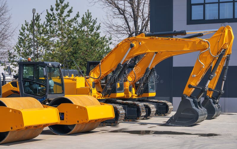 Rollers and Excavators Stands in the Parking Lot Stock Image - Image of ...