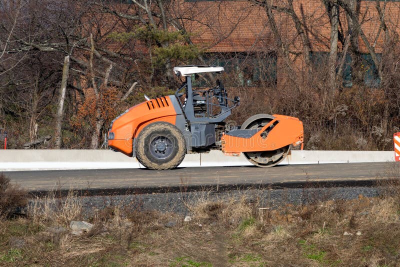 Rollers Rolling Fresh Hot Asphalt on the New Road Road Construction ...