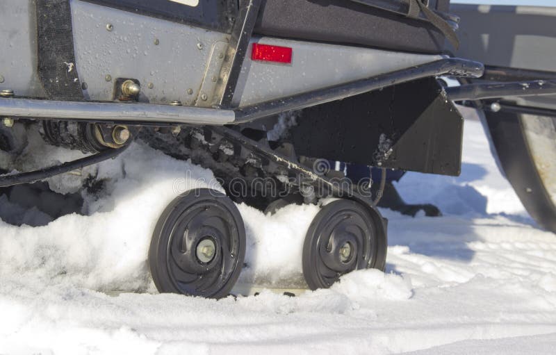 Rollers of the snowmobile stock photo. Image of frost - 144189858