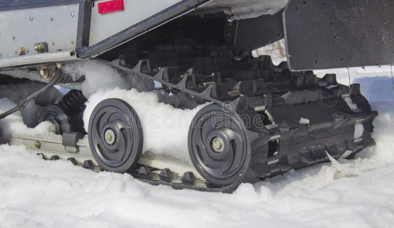 Rollers of the snowmobile stock photo. Image of black - 144190060