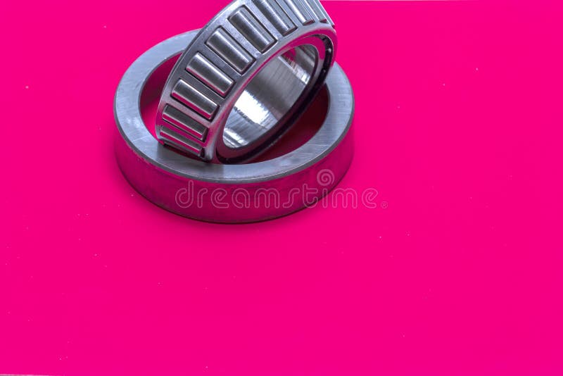 The Rolling Bearing is Conical, Roller on a Red Background,close-up ...