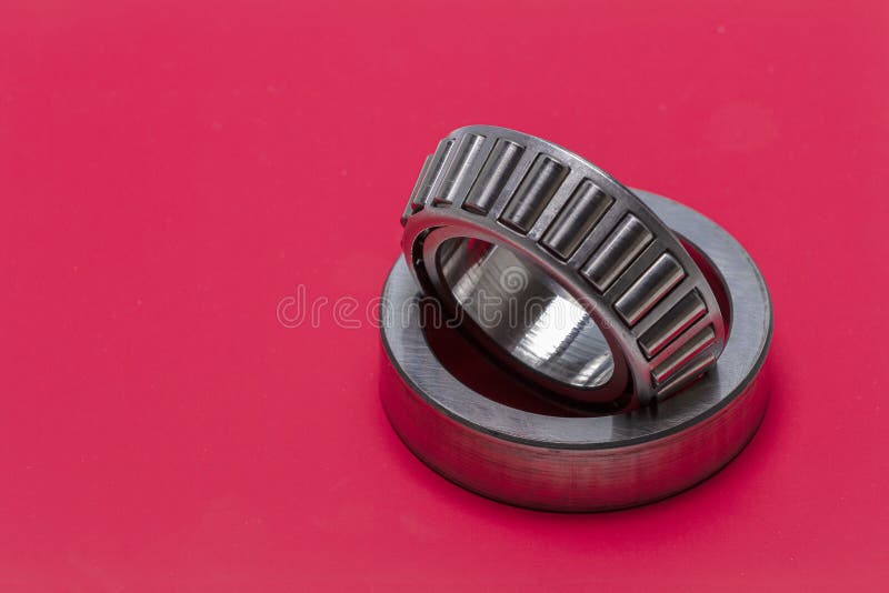 The Rolling Bearing is Conical, Roller on a Red Background,close-up ...