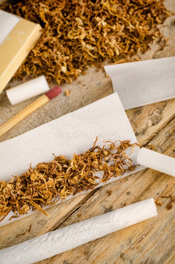 Rolling cigarettes stock image. Image of rolling, book - 63528347
