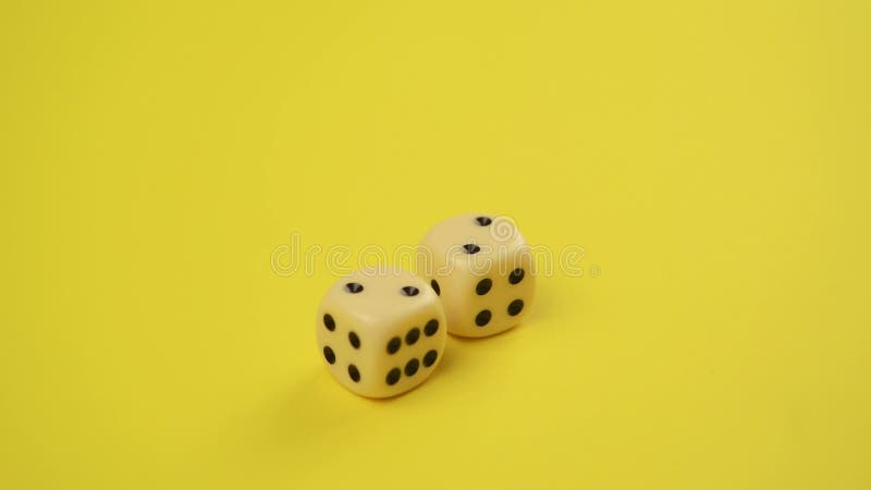 Rolling Dice on Yellow Background As Gambling and Probability Concept ...