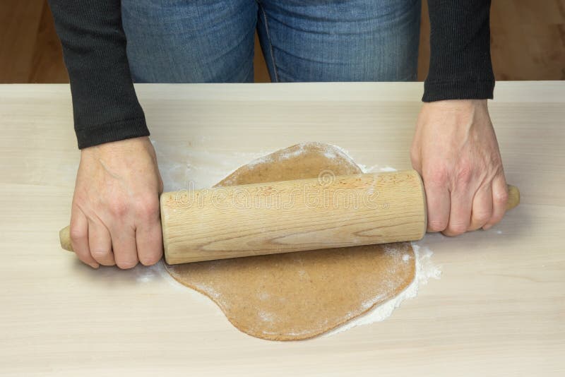 Rolling the Dough by Wooden Rolling Pin Stock Photo - Image of dessert ...