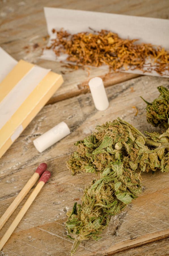 Rolling a joint stock photo. Image of rustic, paper, smoking - 63942826