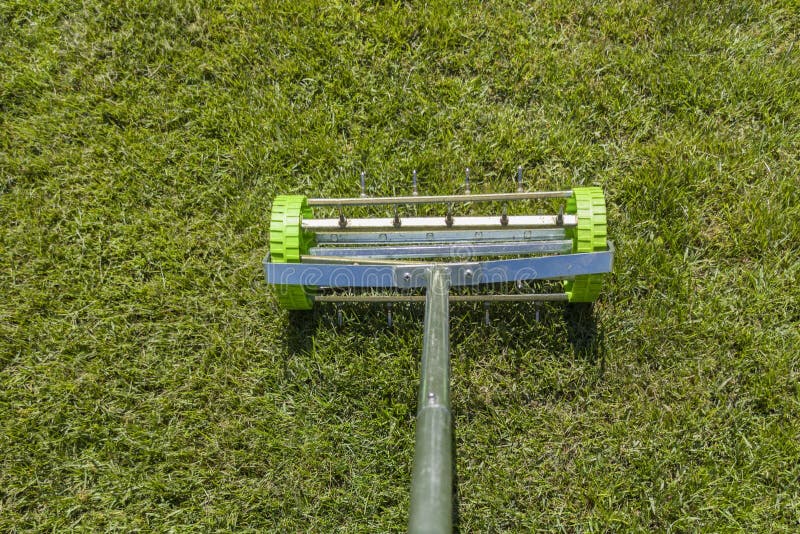 Rolling Lawn Aerator Lawn in Action Stock Photo - Image of conditioner ...