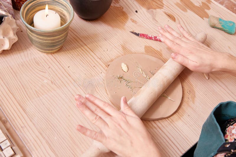 Rolling Out the Clay Mass for Sculpting a Wall Panel Stock Image ...